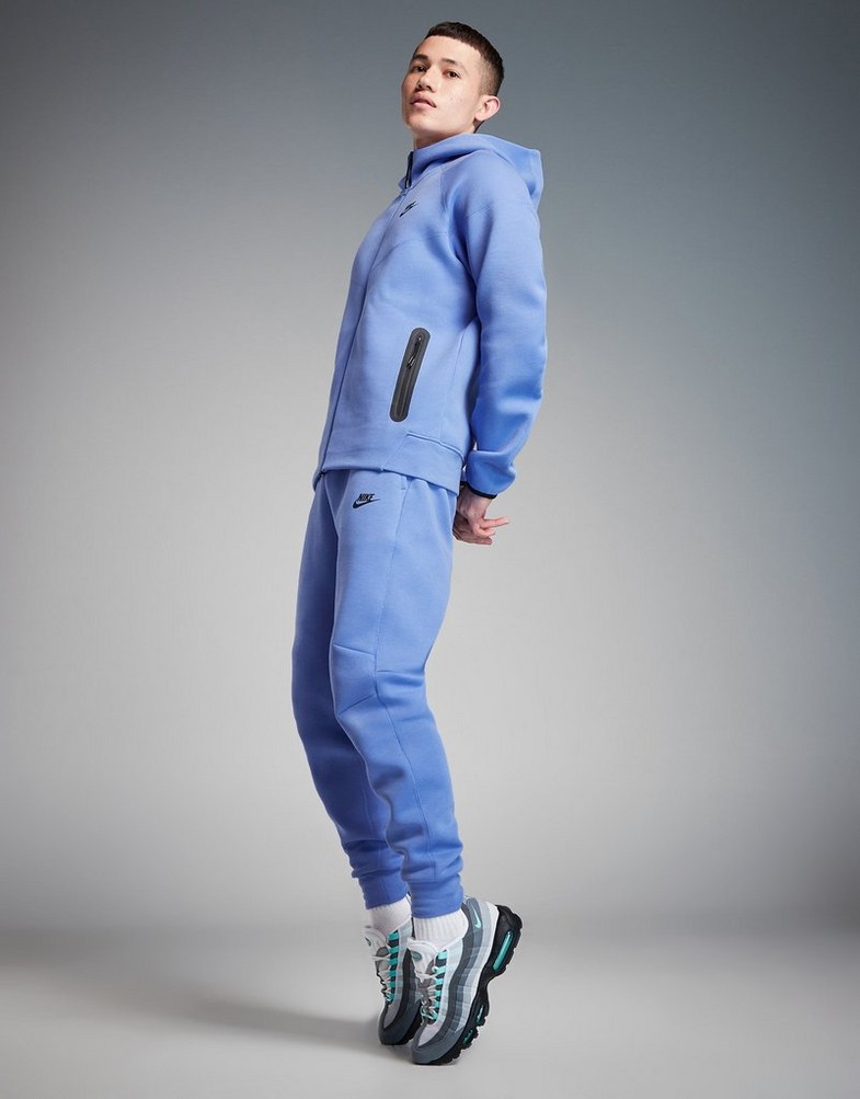 NIKE SPODNIE M NK TCH FLC JGGR FB8002-450 | kolor Niebieski Męskie ...