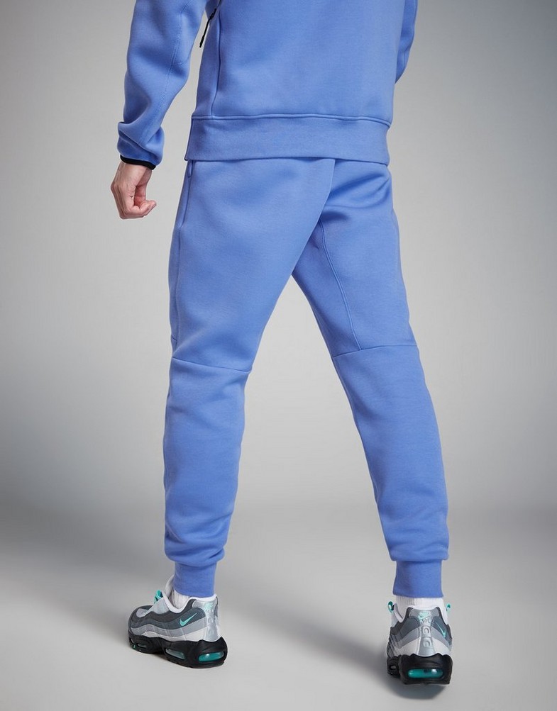 NIKE SPODNIE M NK TCH FLC JGGR FB8002-450 | kolor Niebieski Męskie ...